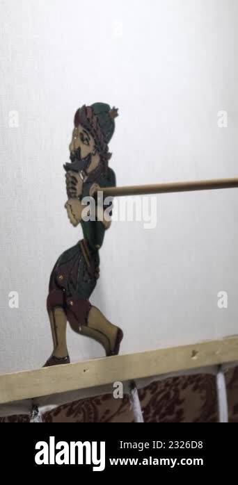 Traditional theater play performed using shadow play, curtain, light ...