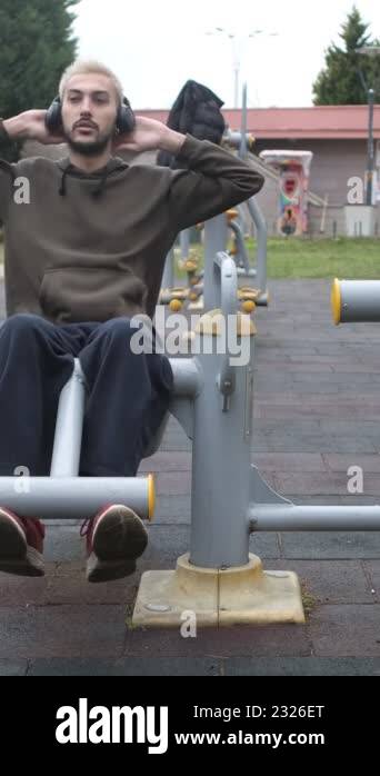 Doing sit-ups while listening to music, doing sports on public sports ...