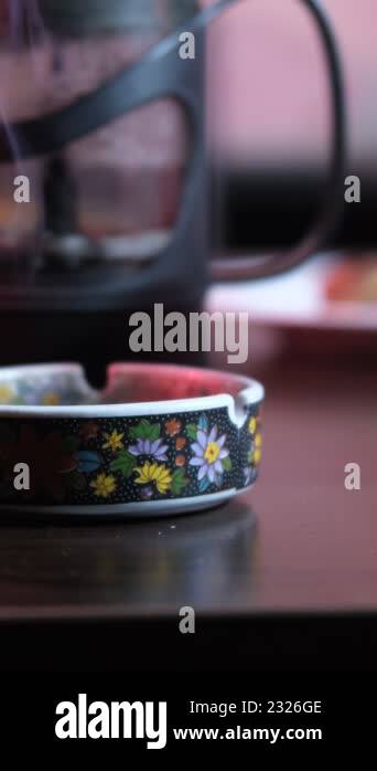 Close-up view of coffee and cigarette ashtray, coffee and cigarette ...