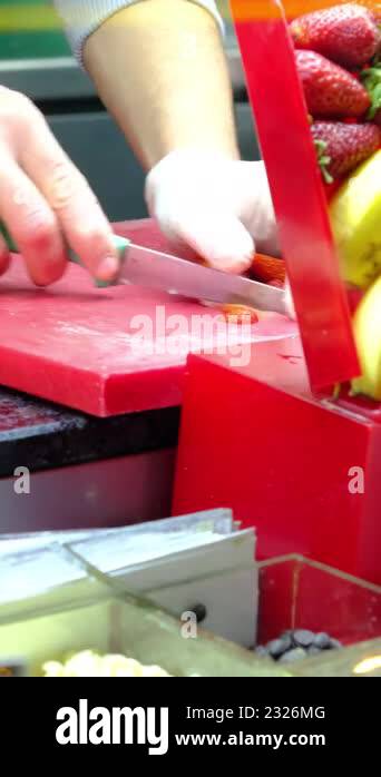 Street food waffle making, chef making a taste show in touristic areas ...