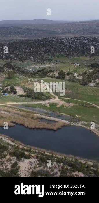 Aerial view of a small lake with mountain view, top view of earth ...