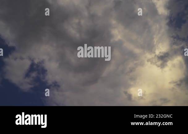 Fast moving white and black cumulus clouds. Blue sky with several layers of clouds Stock Video ...