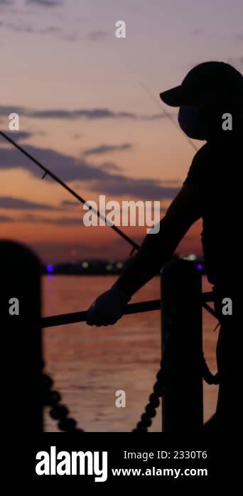 Silhouette of man wearing white mask on face from covid virus while ...