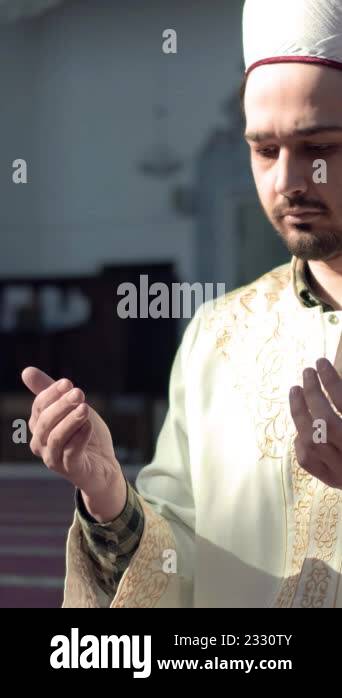 Different angle shot of imam sitting in mosque masjid while praying ...