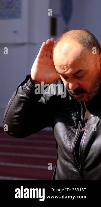 Muslim adult man who begin to pray, raise their hands to their heads ...