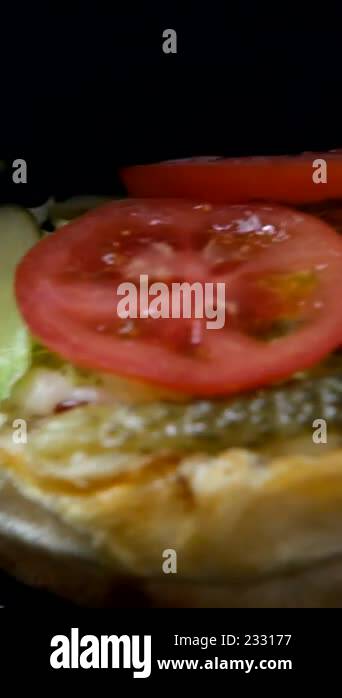 Slow motion shot of layered hamburger making, image of hamburger ...