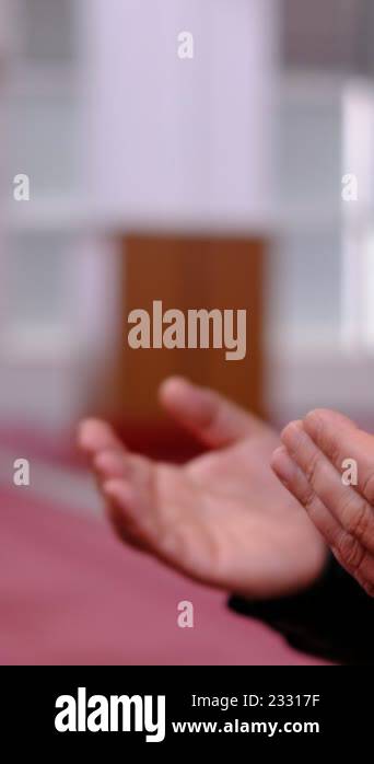 An old man raising his hands and praying from the mosque, Muslim men ...