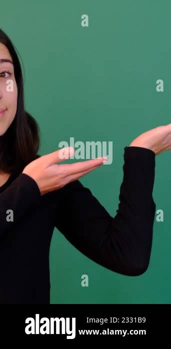 Woman show right, smiling girl giving directions down, young people ...