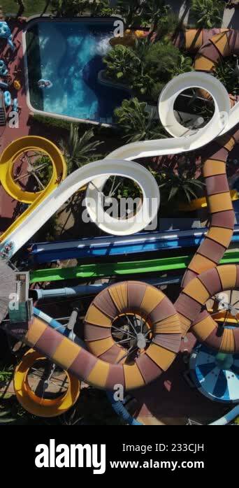 Great aquapark fun, people having fun in the big aquapark jump into the pool, holidaymakers ...