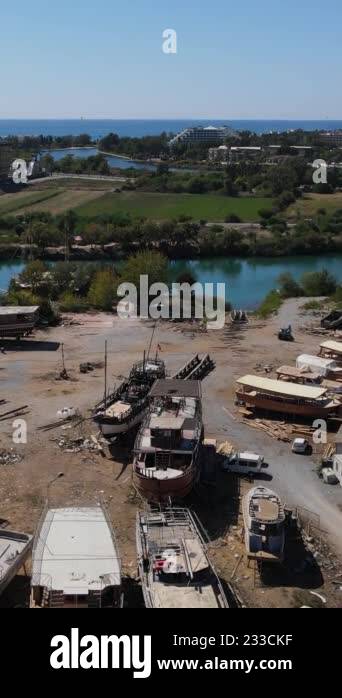 shipyard by the river, Aerial view of boats under construction at ...