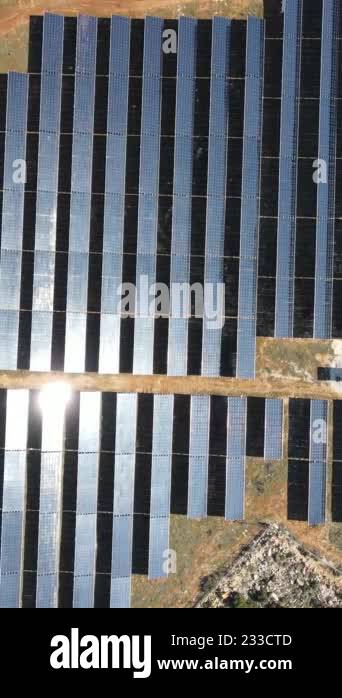 Aerial drone view of solar panels installed on mountain land, solar ...