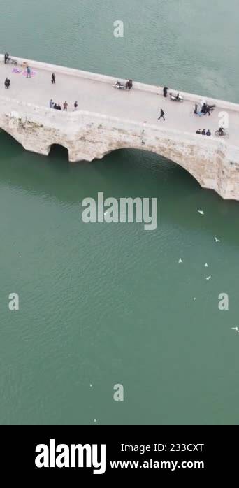 The drone images of vehicle traffic passing over the bridge over the ...