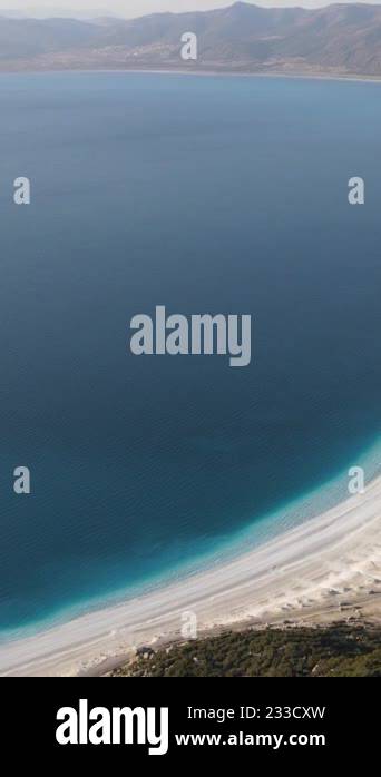 Drone view of volcanic lake Salda lake surrounded by mountains ...