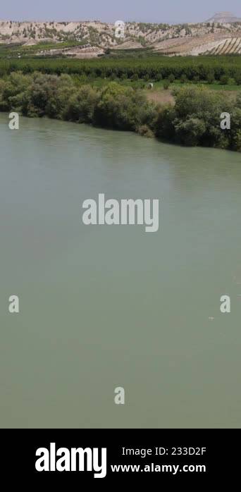 Aerial Riverside Habitat, water flow in the creek bed, agricultural ...