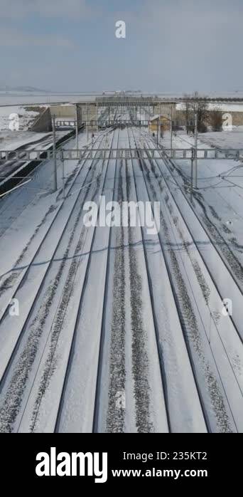 Drone view of the railway and station points in the middle of the wide ...