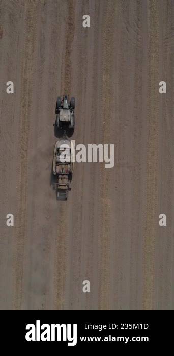Bale tractor return, Aerial drone view of the bale tractor turning at ...