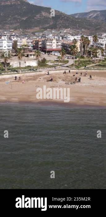 Drone view of mersin beach cleaning by people, aeriel outlook of ...