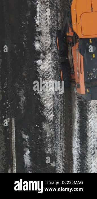 aerial view of snow plows, drone shot snow plows clearing the snow and ...