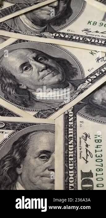 Background with One Hundred Dollar Bills on a Rotating Platform. Stack of cash. Close-up ...