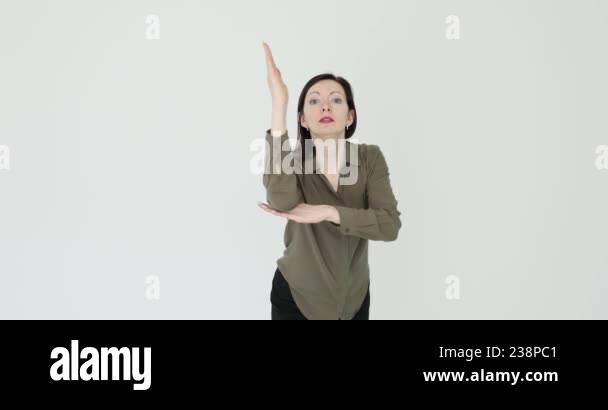 Woman demonstrates sign language raising hand and is ready to answer ...