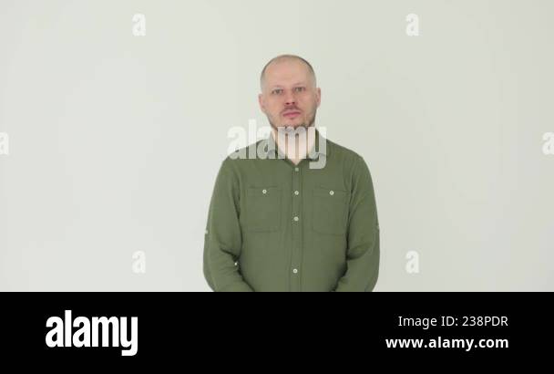 Man nodding his head in agreement on white background. Guy approves ...