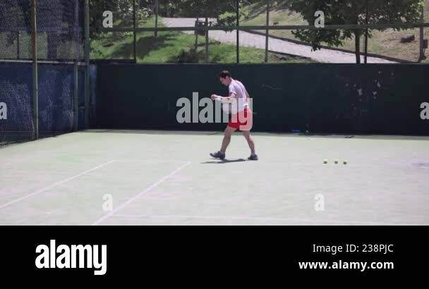 Tennis practice on a local court on a sunny day. Tennis players playing ...