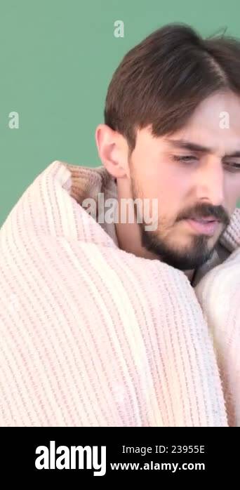 Man wrapped in a warm blanket shivering with cold, people get cold in ...