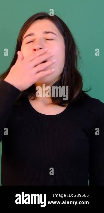 Tired Girl Yawn On Green Screen Young Woman Covers Her Open Mouth With