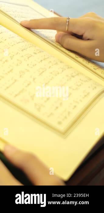 Reading Arabic Alphabet, reciting prayers from islamic book, verse of ...