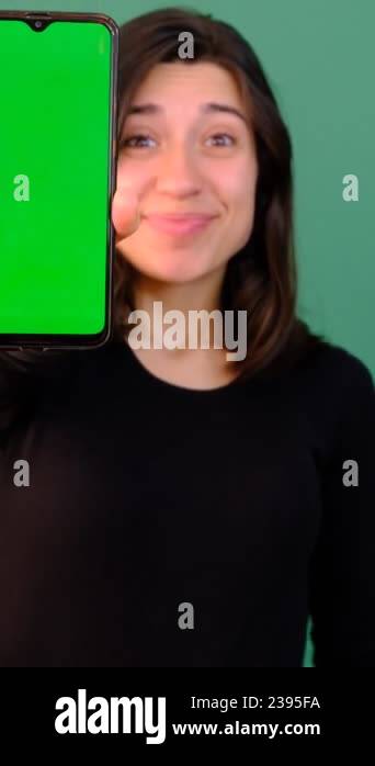 Girl shocked phone green screen, beautiful girl gestures confused sign ...