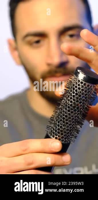 Male hair care combing image across camera, the section above the hair ...