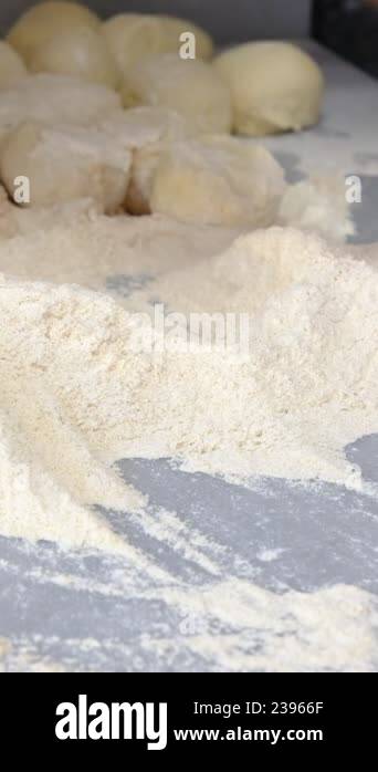 Male chef preparing dough, making lavash meringues, people working in ...