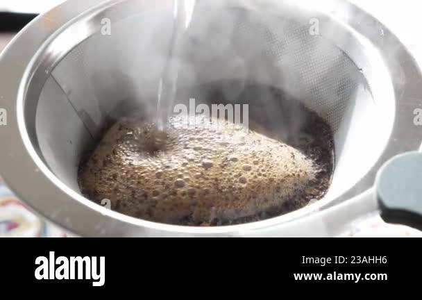 Drip coffee - Scene of pouring hot water and dripping Stock Video ...