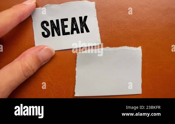 Sneak peek message writing on ripped torn paper pieces on brown background Stock Video Footage ...