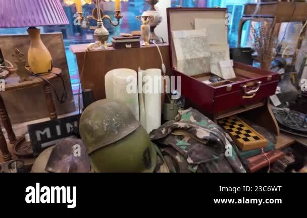Vintage collection of military artifacts, old maps, and retro furniture ...
