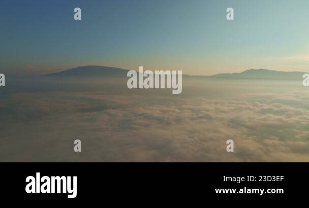 Aerial view of sea of mist cover the mountain Stock Video Footage - Alamy