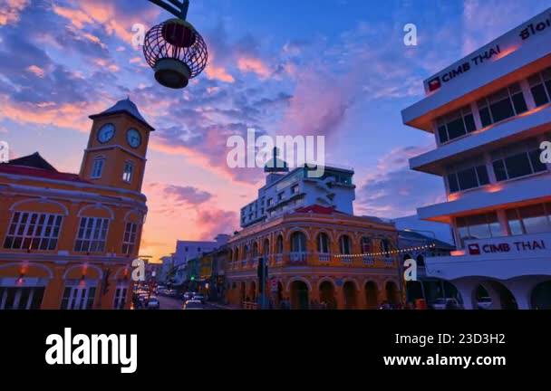 Pink cloud in blue sky above The classic building in Phuket old town. Scene of romantic ...