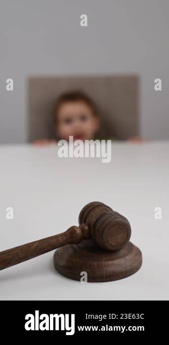 Little boy in front of a judges gavel Stock Video Footage - Alamy