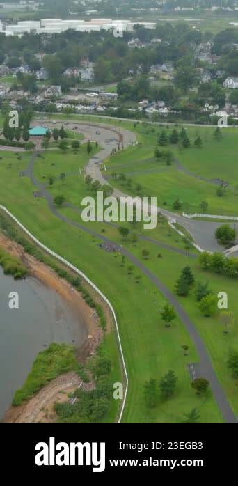 Scenic park showcases wide open spaces, walking paths, trees lining ...