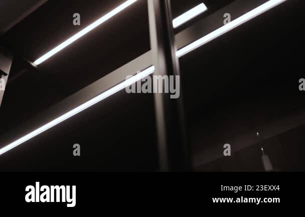 This sleek black shelving unit comes complete with stunning LED ...