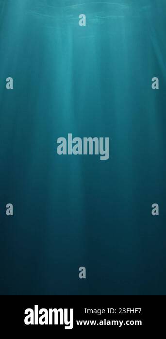 Vertical 4K slow-motion footage of underwater god rays piercing the ...