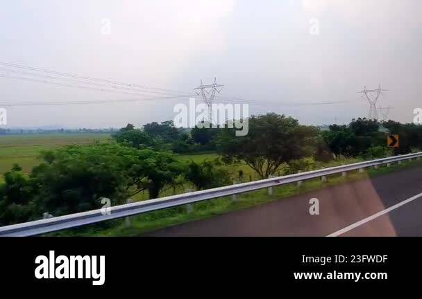 POV of sightseeing a landscape through the window from inside a moving ...