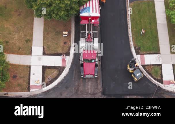 Suburban roadwork development new asphalt road and real estate houses ...