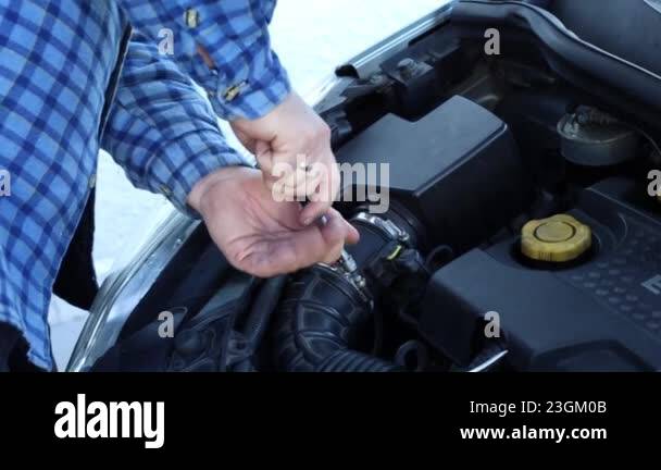 Mans Hands Using Tools to Repair a Car Engine Beneath the Open Hood ...
