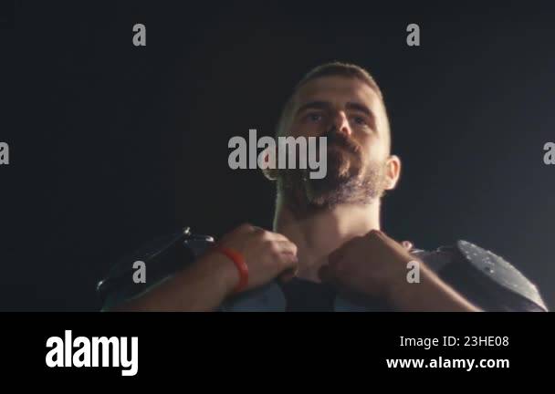 Close-up portrait of an American football player sweating after an ...