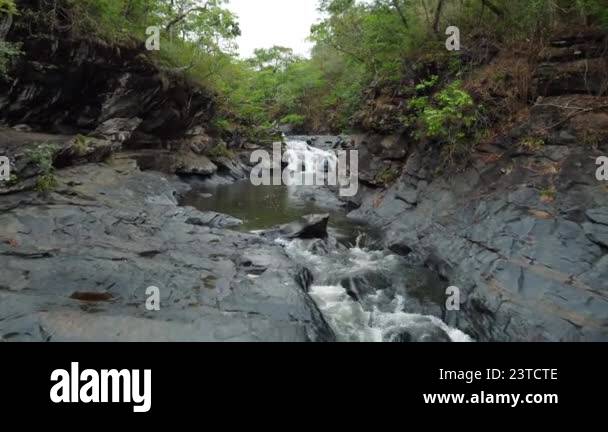 River cutting trough black rocks on the Brazilian Cerrado in Chapada ...
