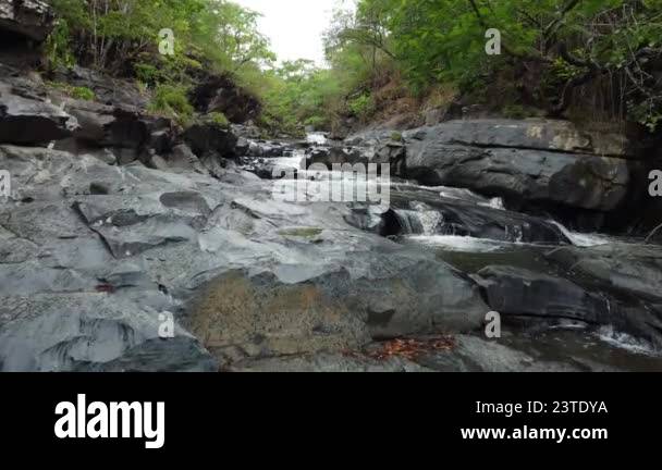 River cutting trough black rocks on the Brazilian Cerrado in Chapada ...
