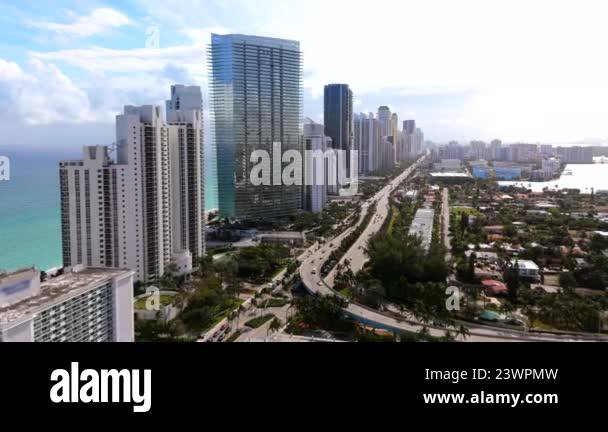 An expansive aerial view of sunlit Miami Beach reveals a charming ...