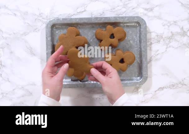 Flat lay. Gingerbread cookies, including a gingerbread man with a heart ...