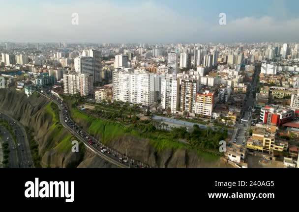 South American coastal city of Lima in Peru as seen from a drone. Green ...